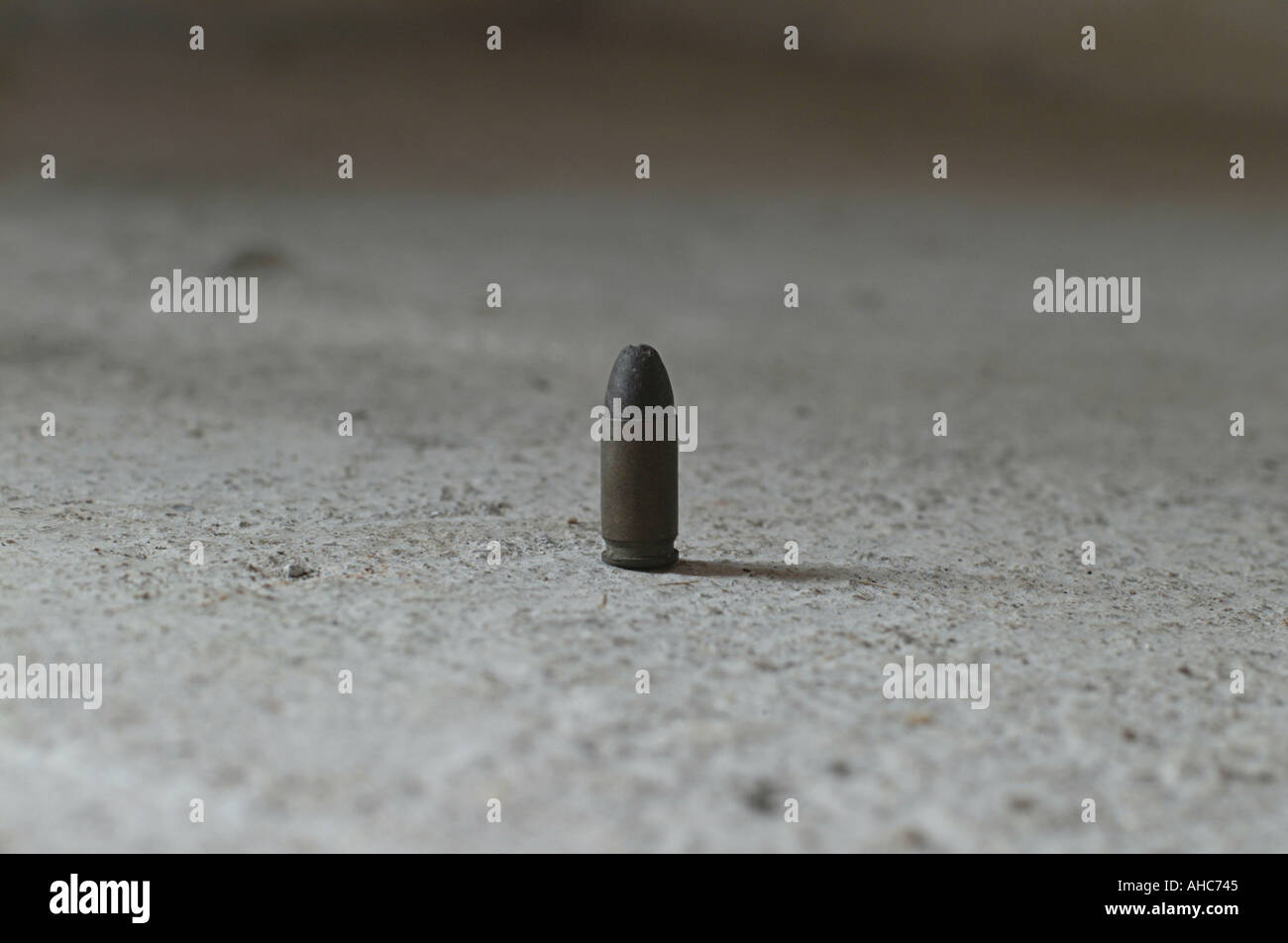 Bullet on the floor Stock Photo - Alamy