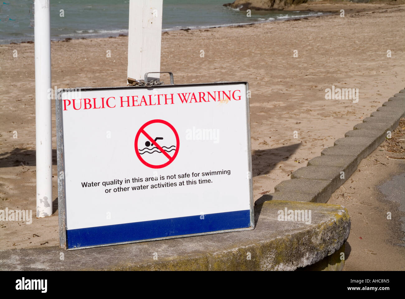 Warning sign on a beach in North Island New Zealand Stock Photo - Alamy