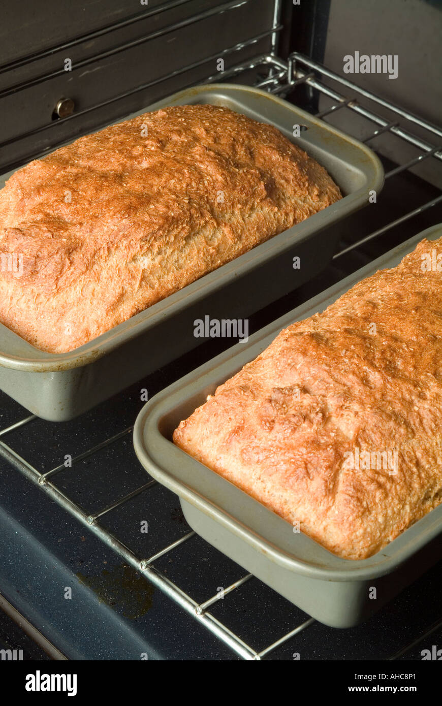 Two loaves of wholemeal bread baking in a domestic oven Stock Photo - Alamy