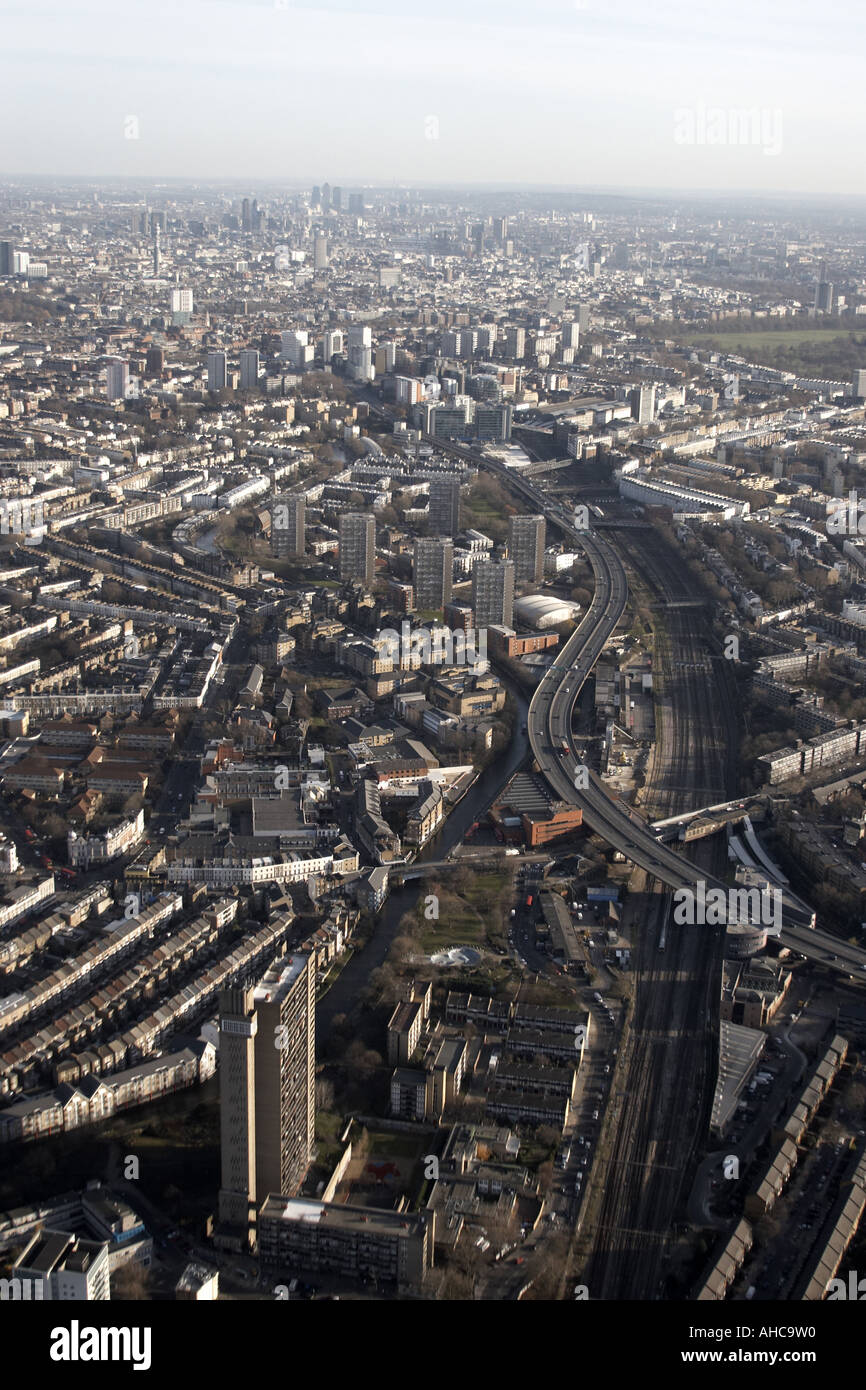 High level oblique aerial view east of suburbs roads houses and streets ...