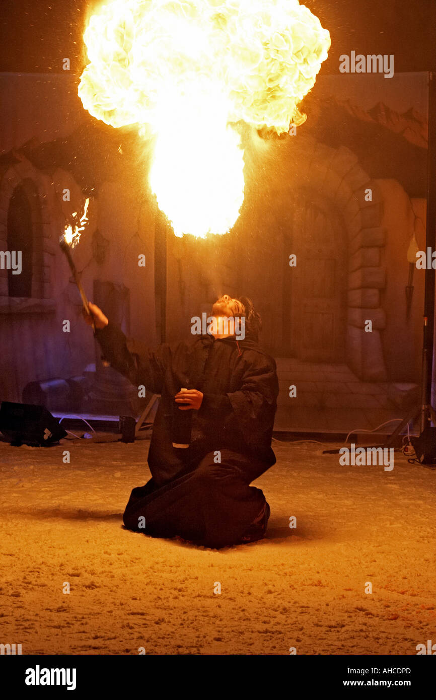 Man fire breathing blowing fire Stock Photo - Alamy