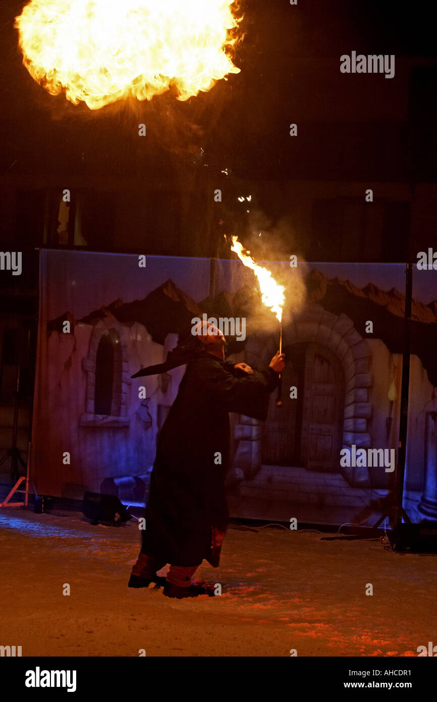 Man fire breathing blowing fire Stock Photo - Alamy
