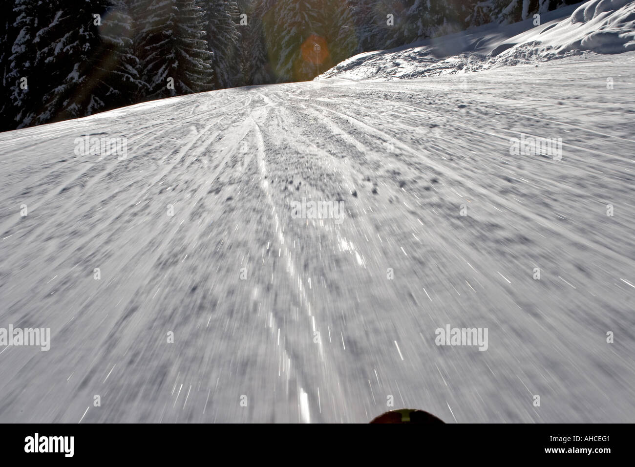 Disconcerting view of piste through woods Stock Photo - Alamy