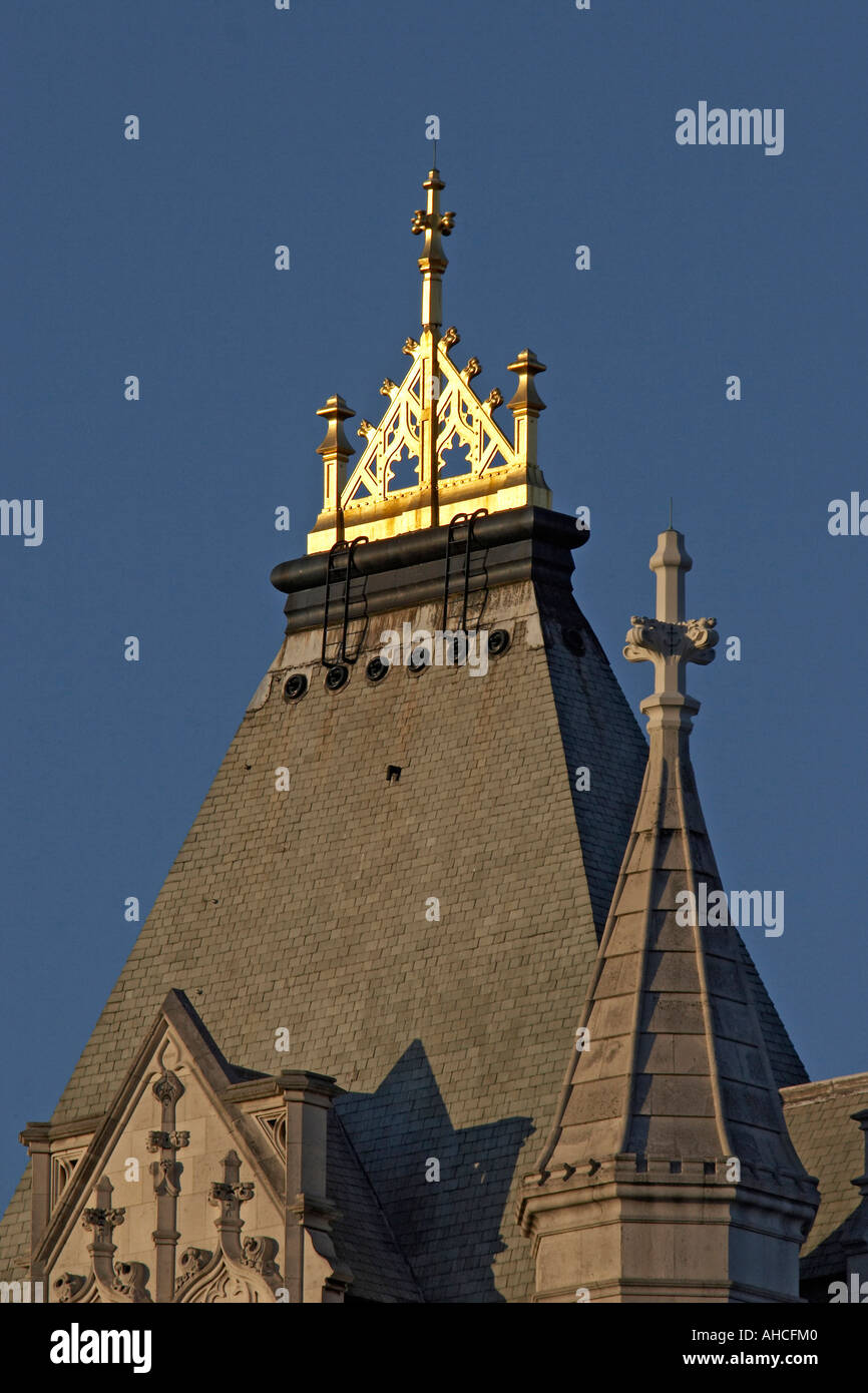 Tower Bridge main tower detail with golden peak apex in warm winter ...