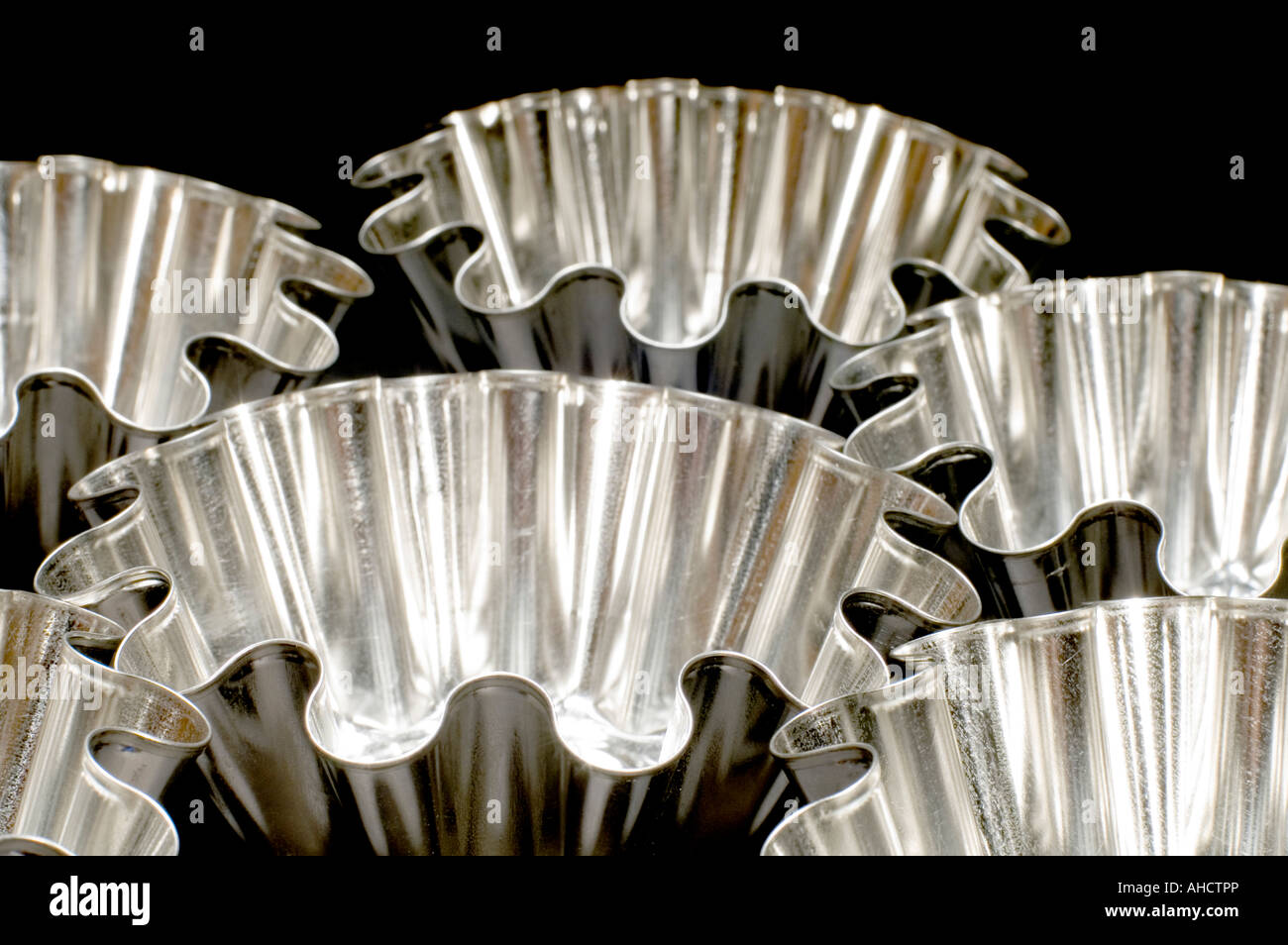 series object on black kitchen utensil Form for baking Stock Photo - Alamy