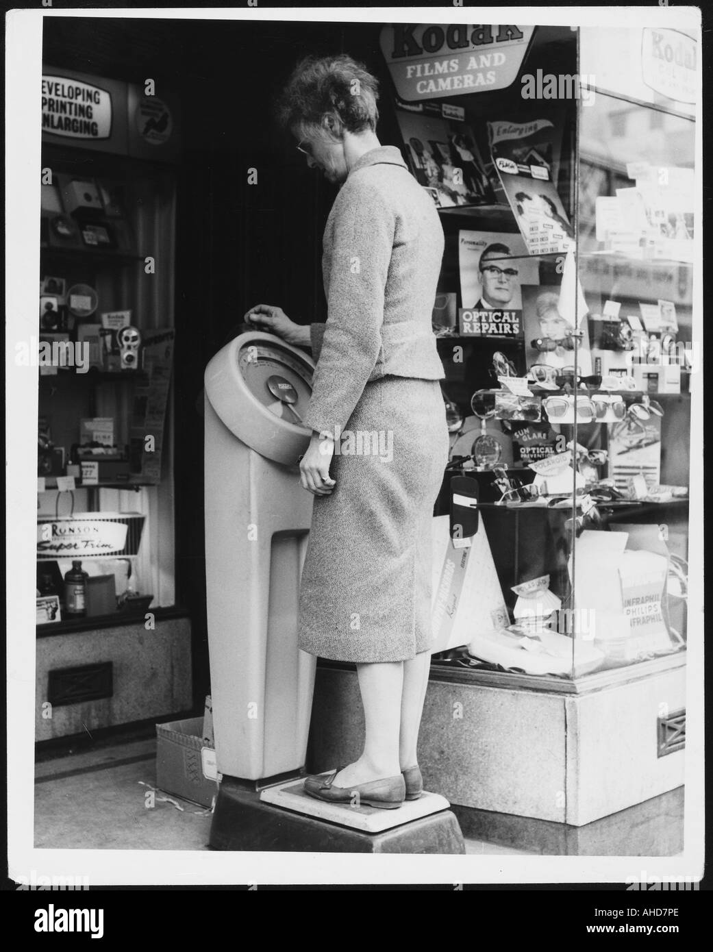 Woman on weighing scales, 1950s hi-res stock photography and images - Alamy