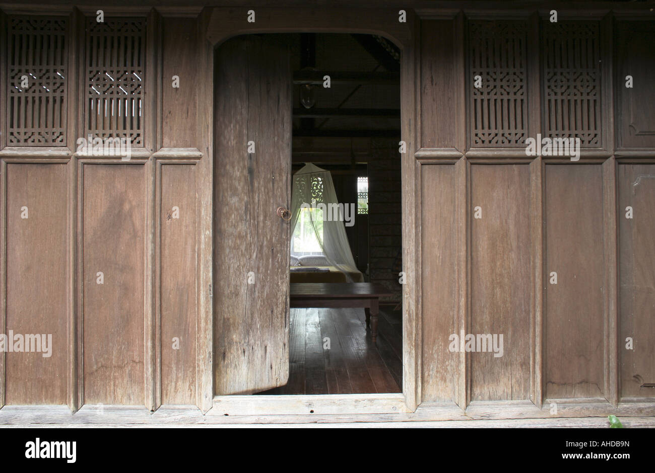 View of a bedroom from half closed door at Pura Tanjung Sabtu in ...
