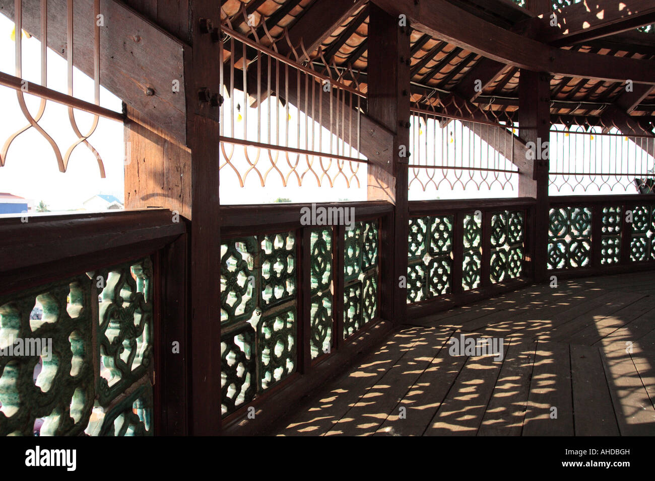 Traditional chinese motif on the railing of an old wooden clock tower ...
