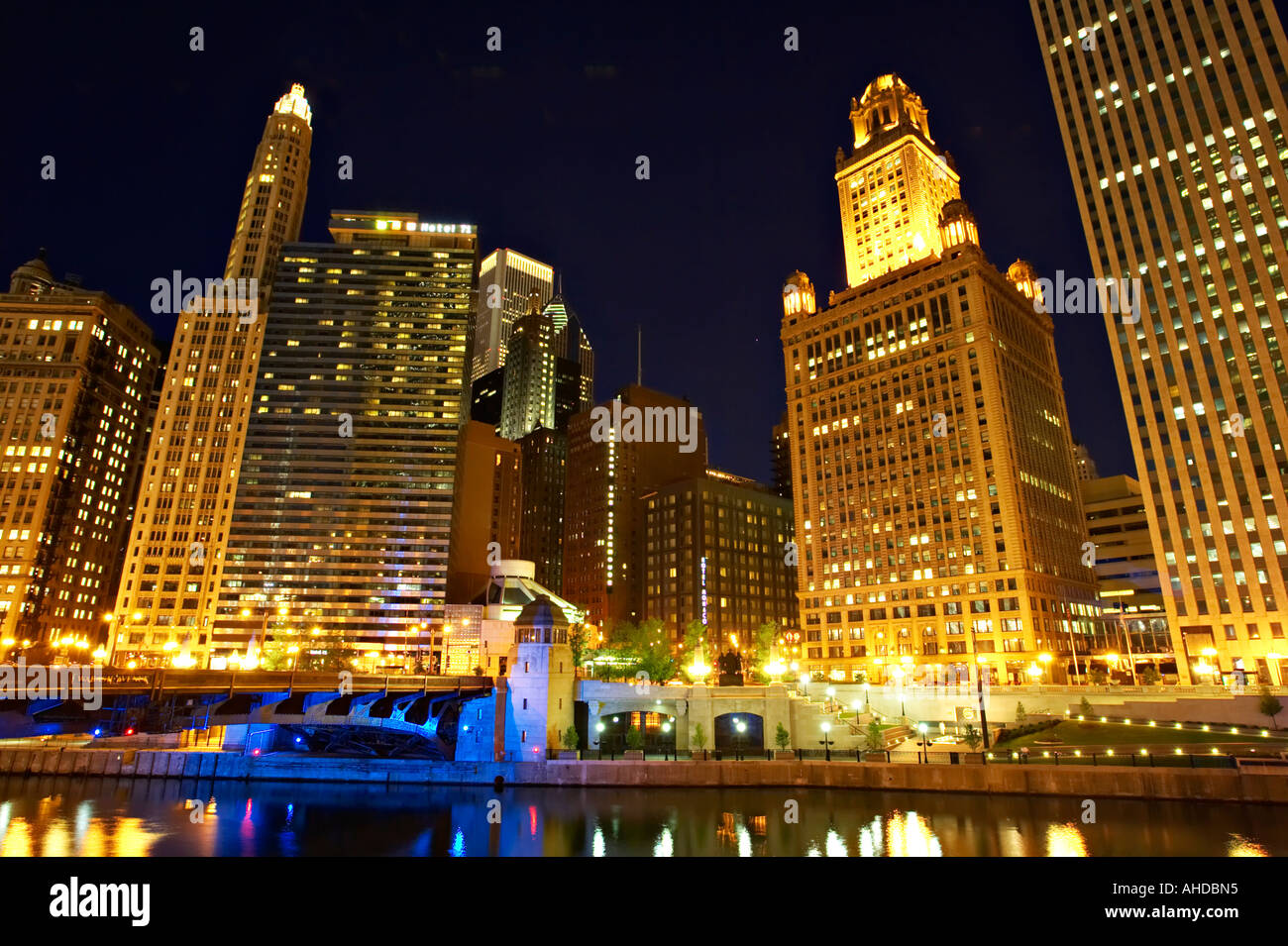 ILLINOIS Chicago Buildings along Chicago River at night lights reflect ...