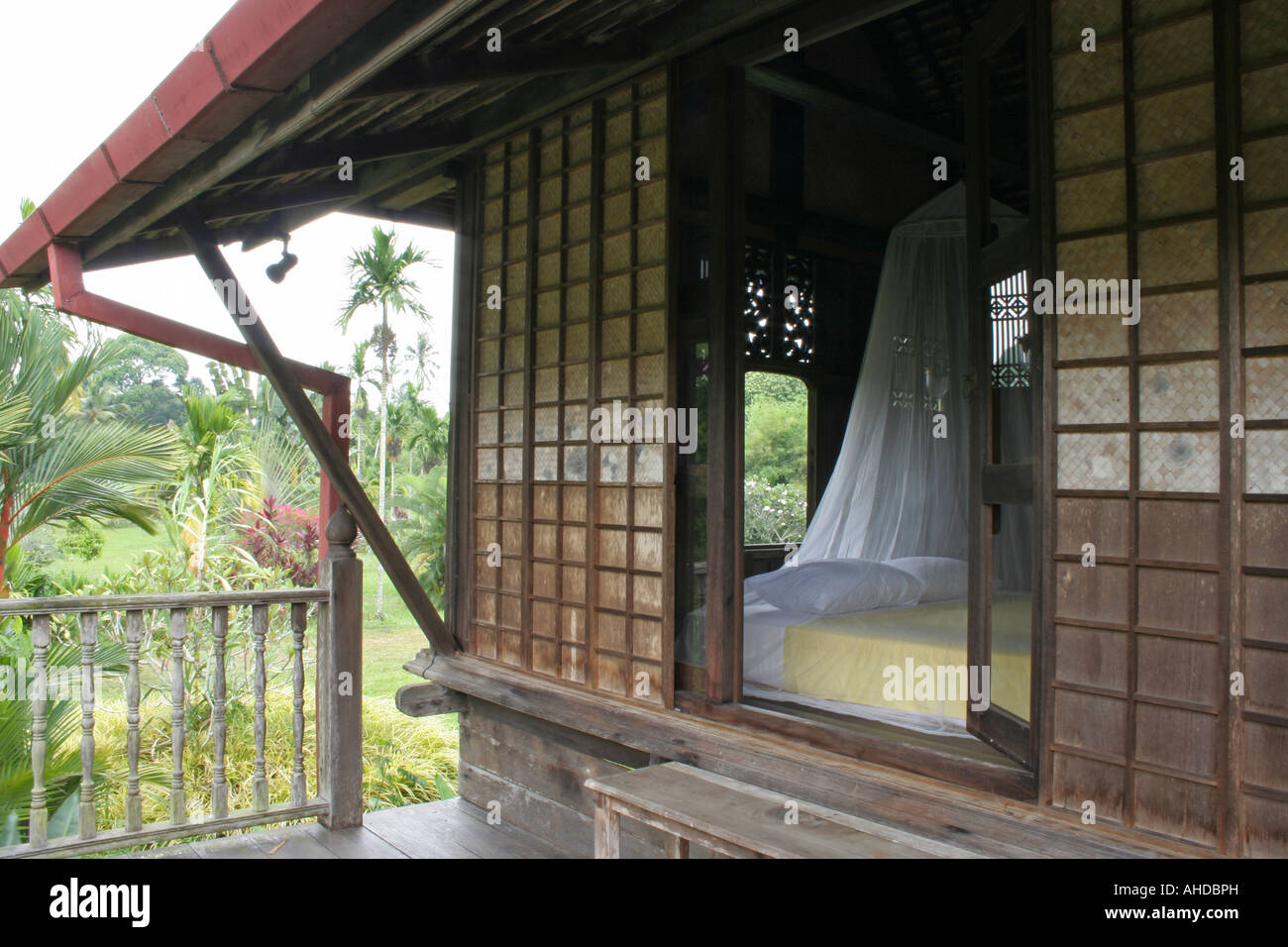 View of a bedroom from half closed door at Pura Tanjung Sabtu ...