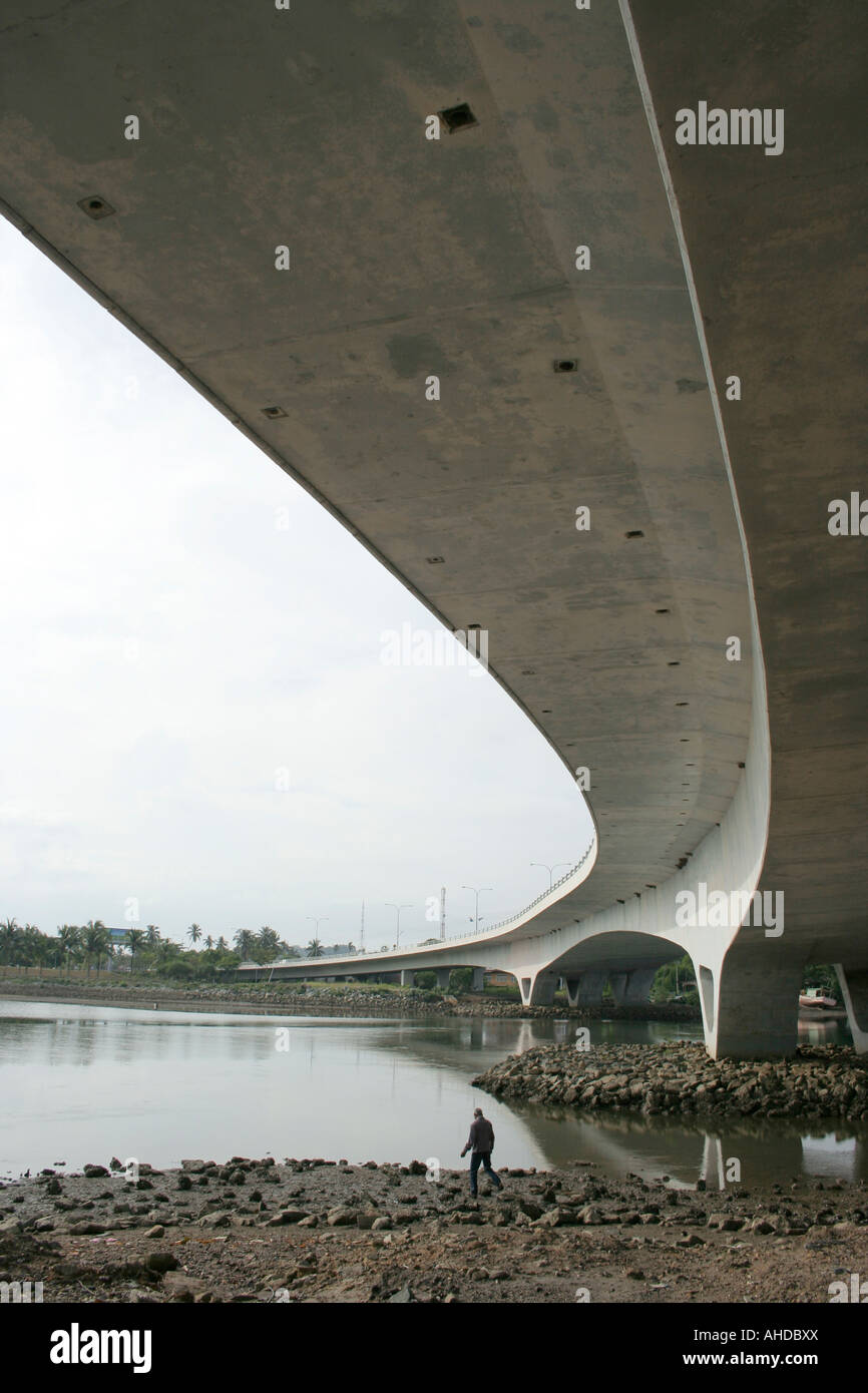A man walking under a curved bridge in Kuala Terengganu, Malaysia Stock ...