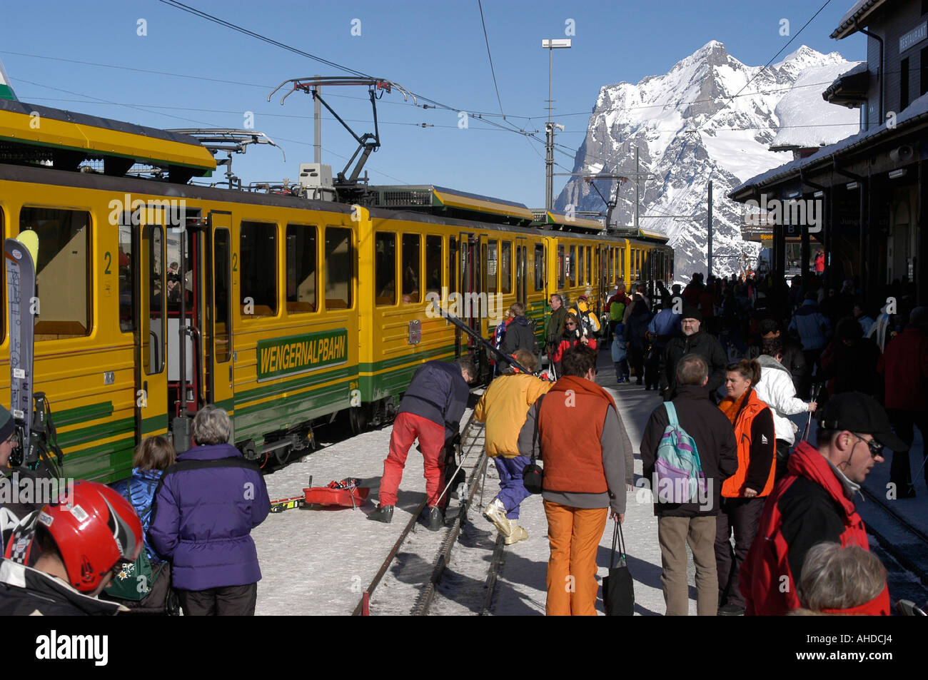 Train and passengers at Kleine Scheidegg mountain station near Wengen ...