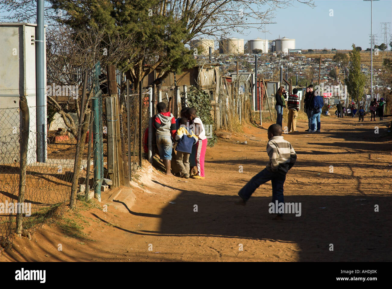 Children in a South African shanty town gather to count the money they ...