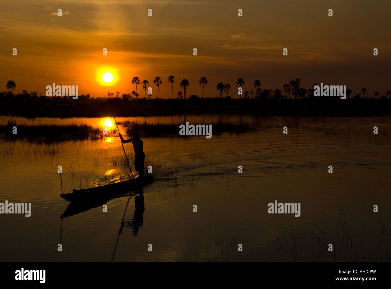 Mokoro canoe at sunset on the Okavango Delta, Botswana Stock Photo - Alamy