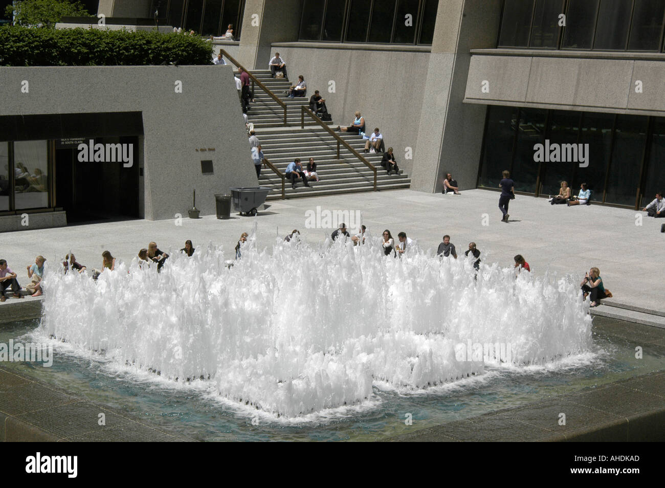 People Sitting Around Water Fountain High Resolution Stock Photography ...