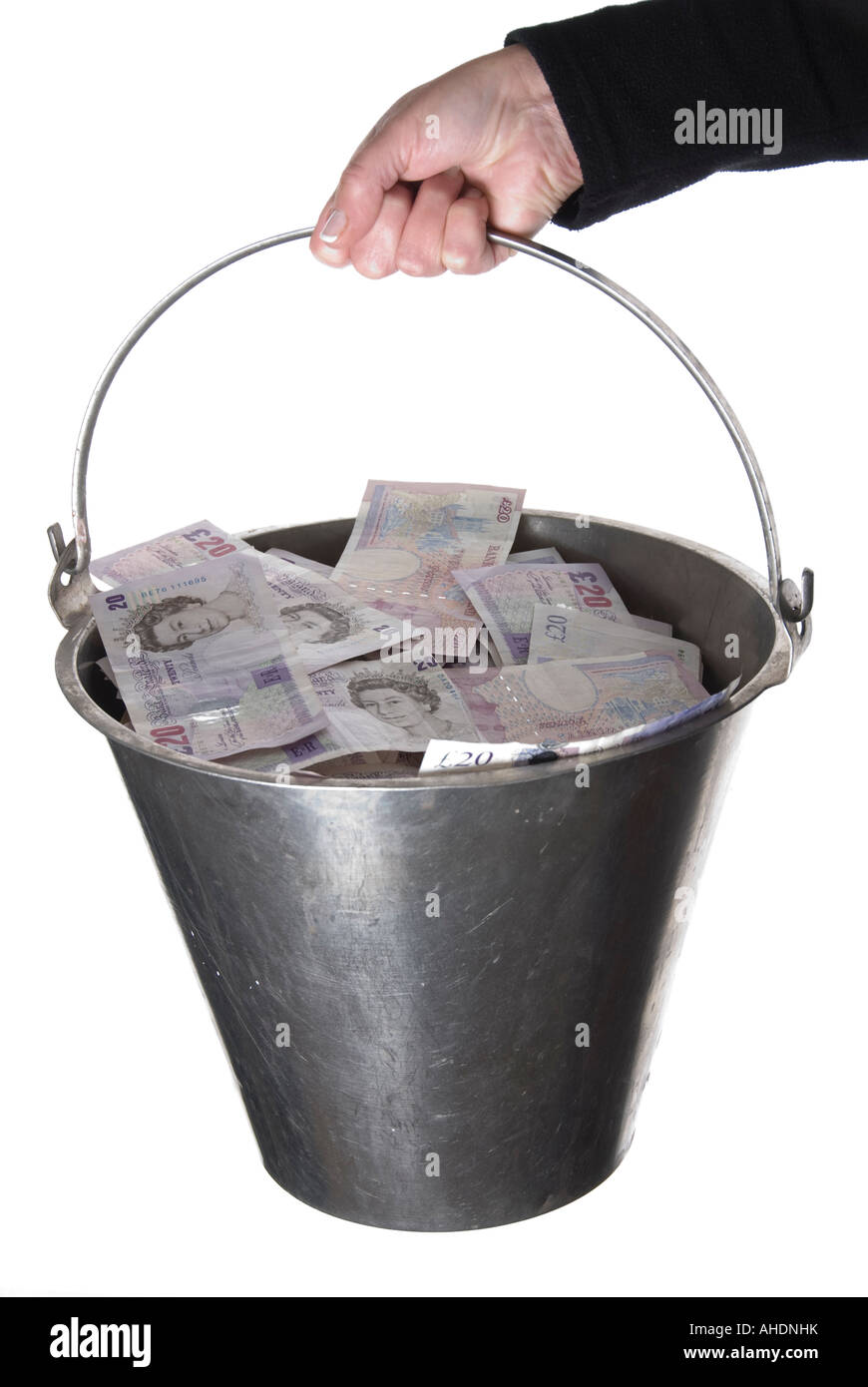 metal bucket full of 20 notes Stock Photo - Alamy