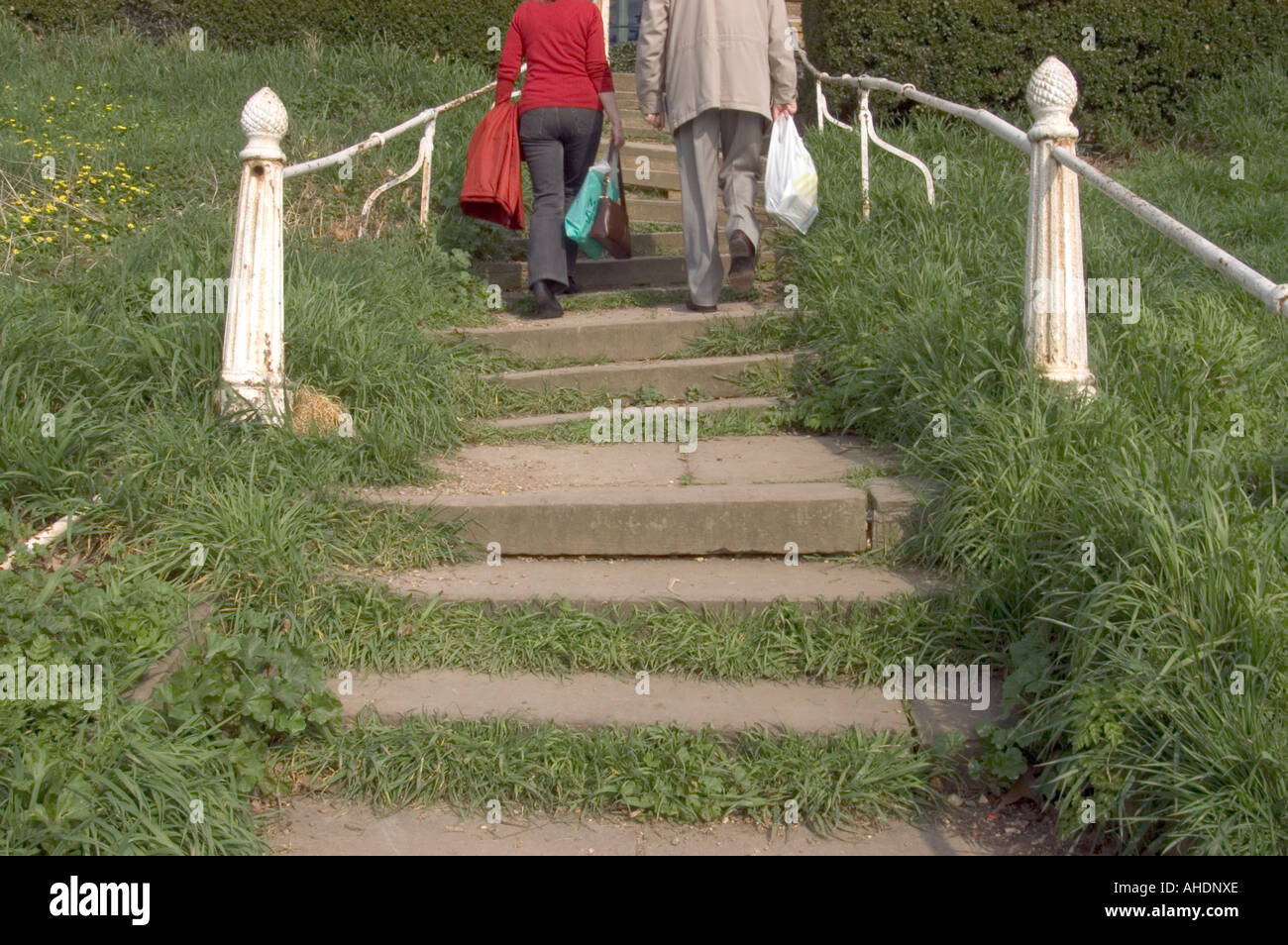 Couple climbing steps in hi-res stock photography and images - Alamy