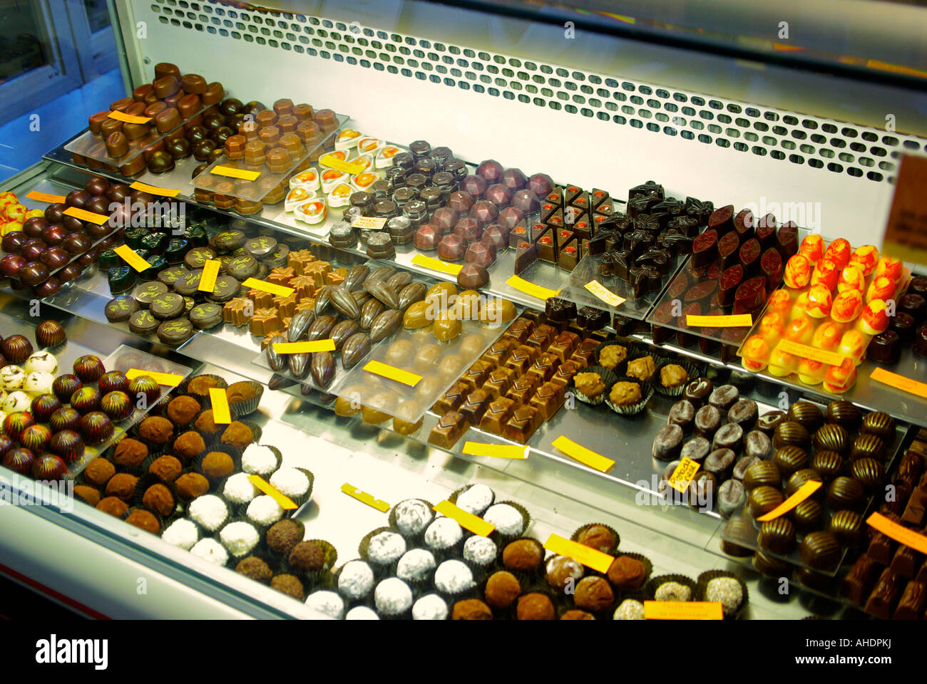 Candies and sweets in a chocolate shop display case Stock Photo - Alamy