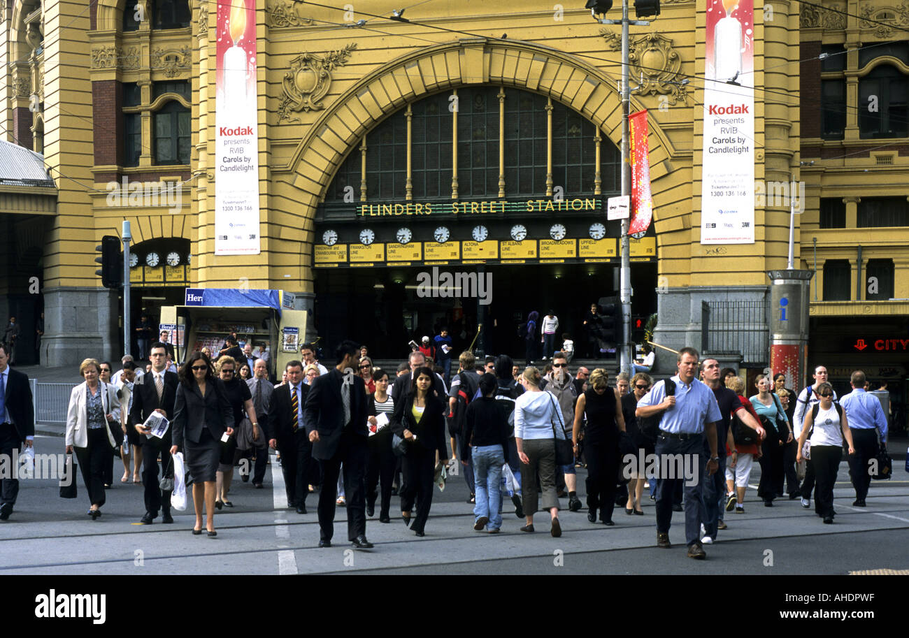 Morning commuters by Flinders Street Station, Melbourne, Australia ...