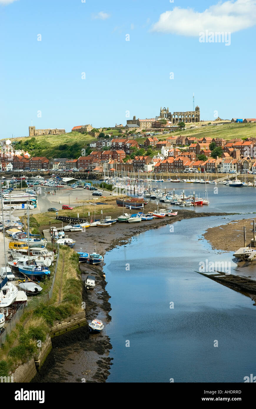 The Abbey dominates the skyline above the harbour on the river Esk at ...