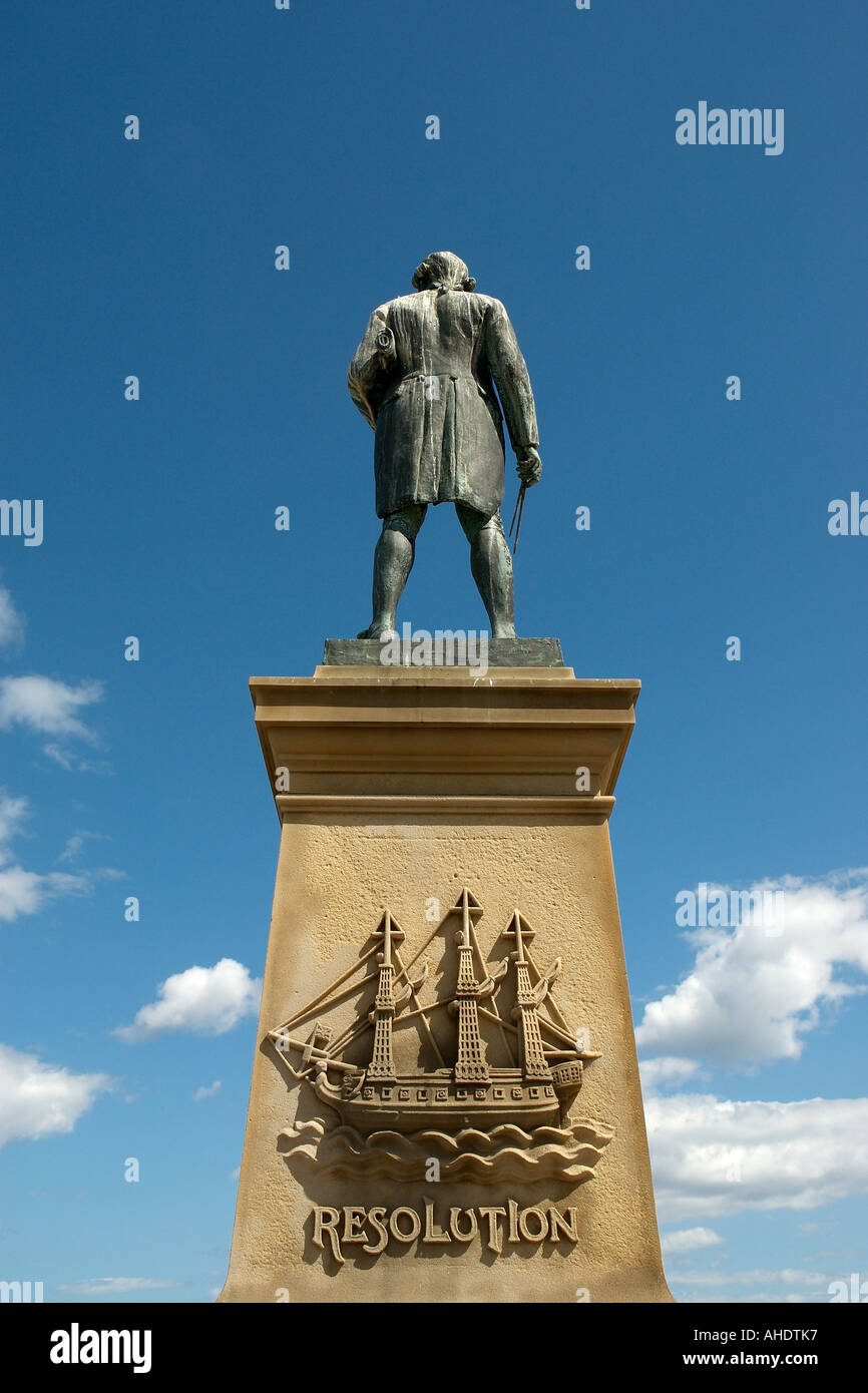 Statue of Captain Cook on a plinth with a sculpture of the ship ...