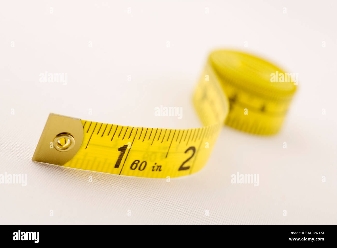 Yellow tape measure Stock Photo - Alamy