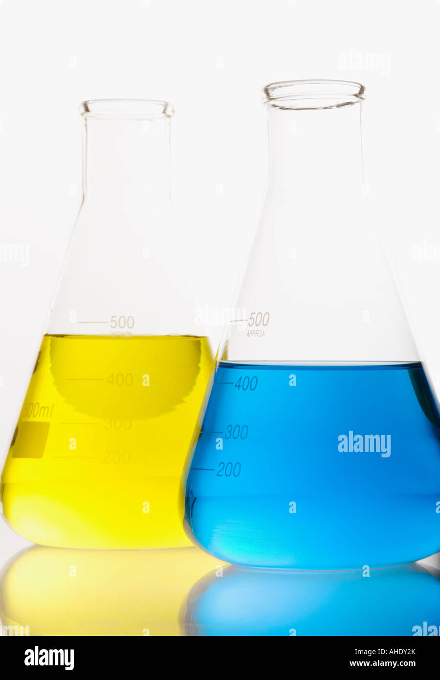 Two flasks with blue and yellow solutions Stock Photo - Alamy