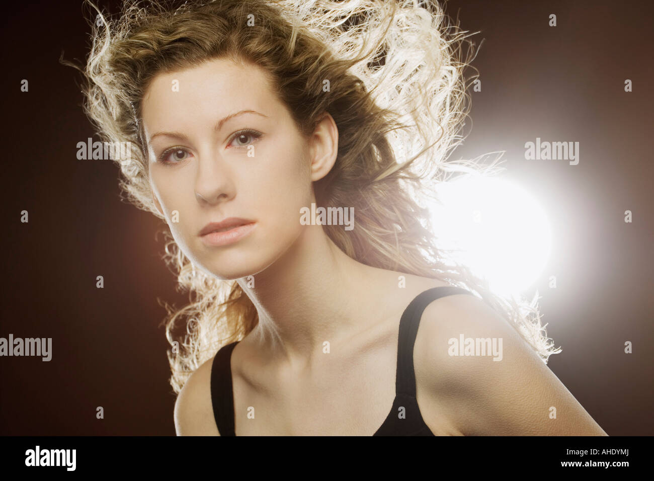 Spotlight on woman Stock Photo - Alamy