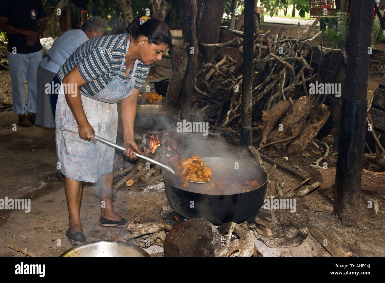Woman cooking over open fire hi-res stock photography and images - Alamy