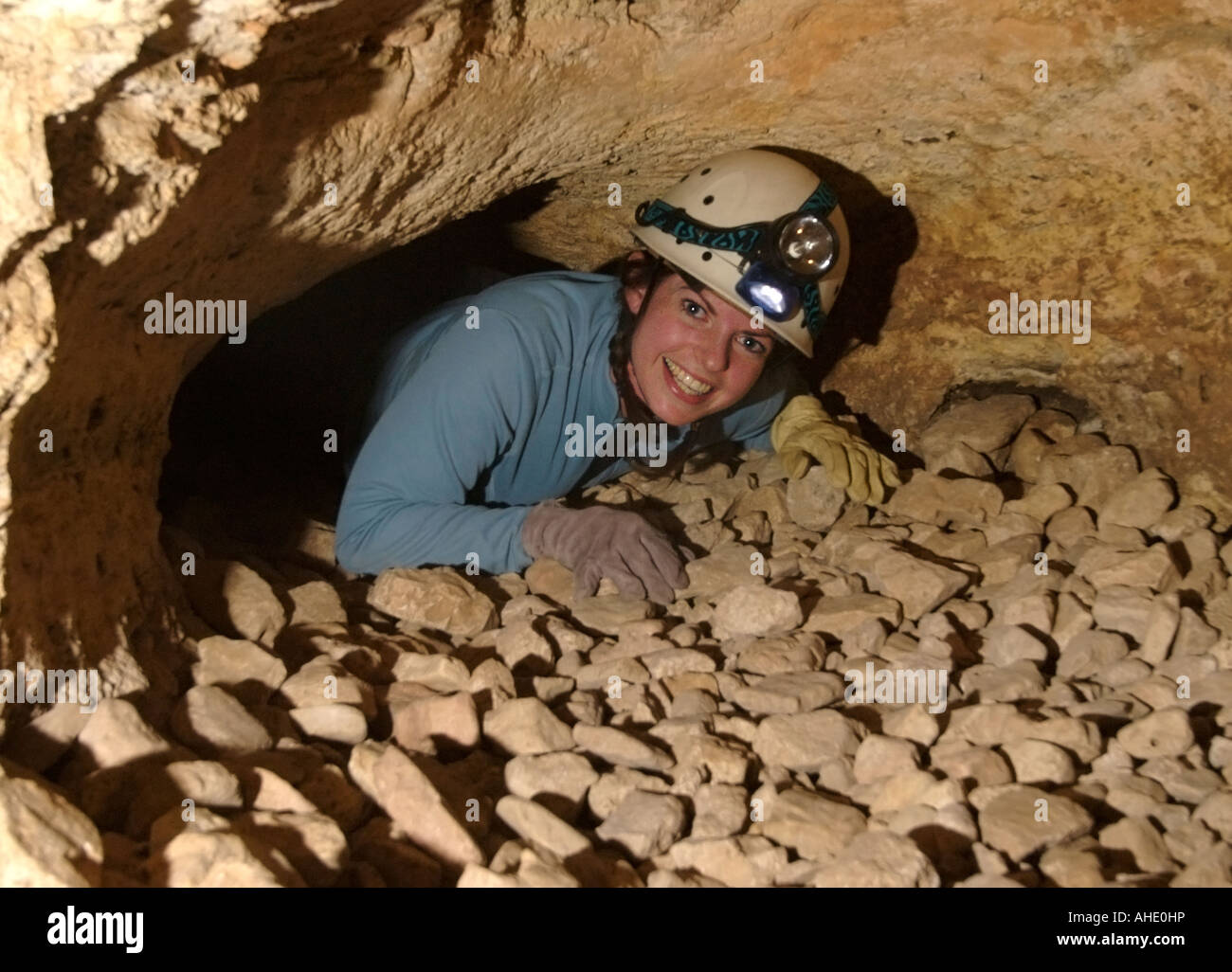 A woman emerges from the crawl in Spider Cave in Carlsbad Caverns ...