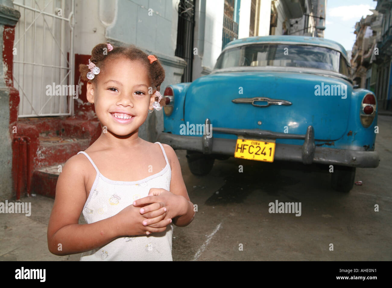 Cuba Havana Beautiful girls in front of a classic car Stock Photo - Alamy