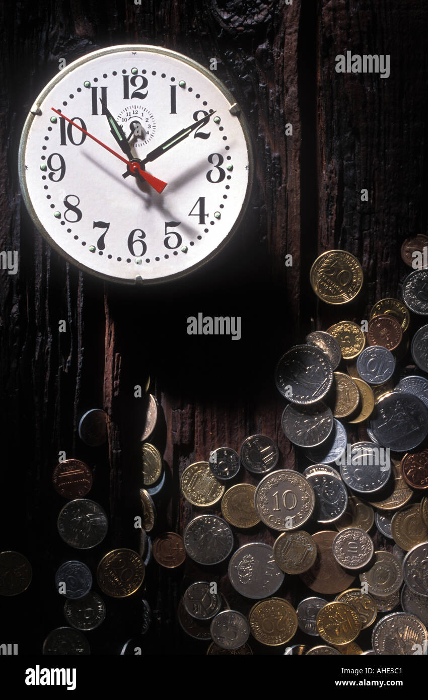 Clock and old coins of many countries Stock Photo - Alamy