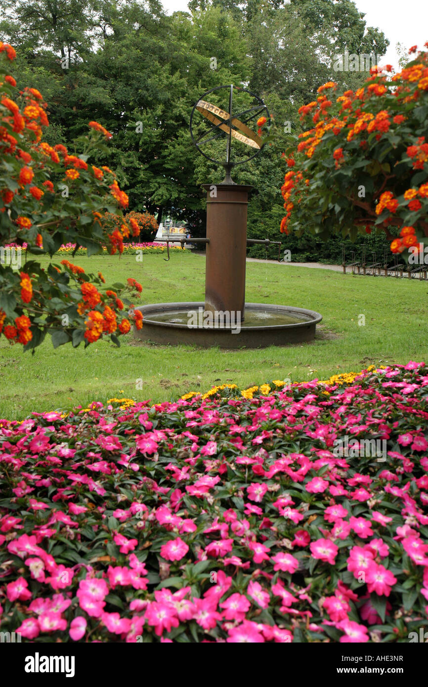 Sun dial in colourful garden hi-res stock photography and images - Alamy