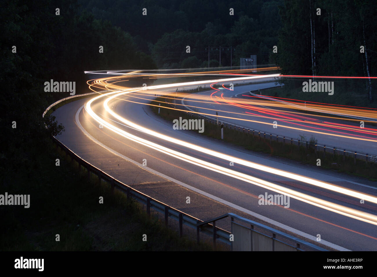 Light trails from cars and trucks on a motorway at night Stock Photo ...