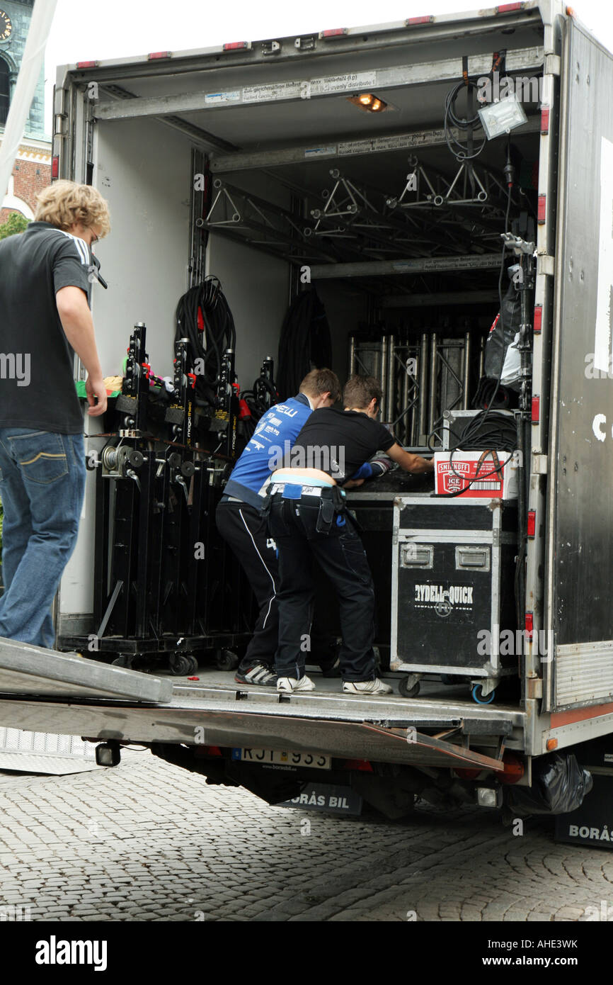 Roadies unloading a truck with gear for a rock concert Stock Photo ...