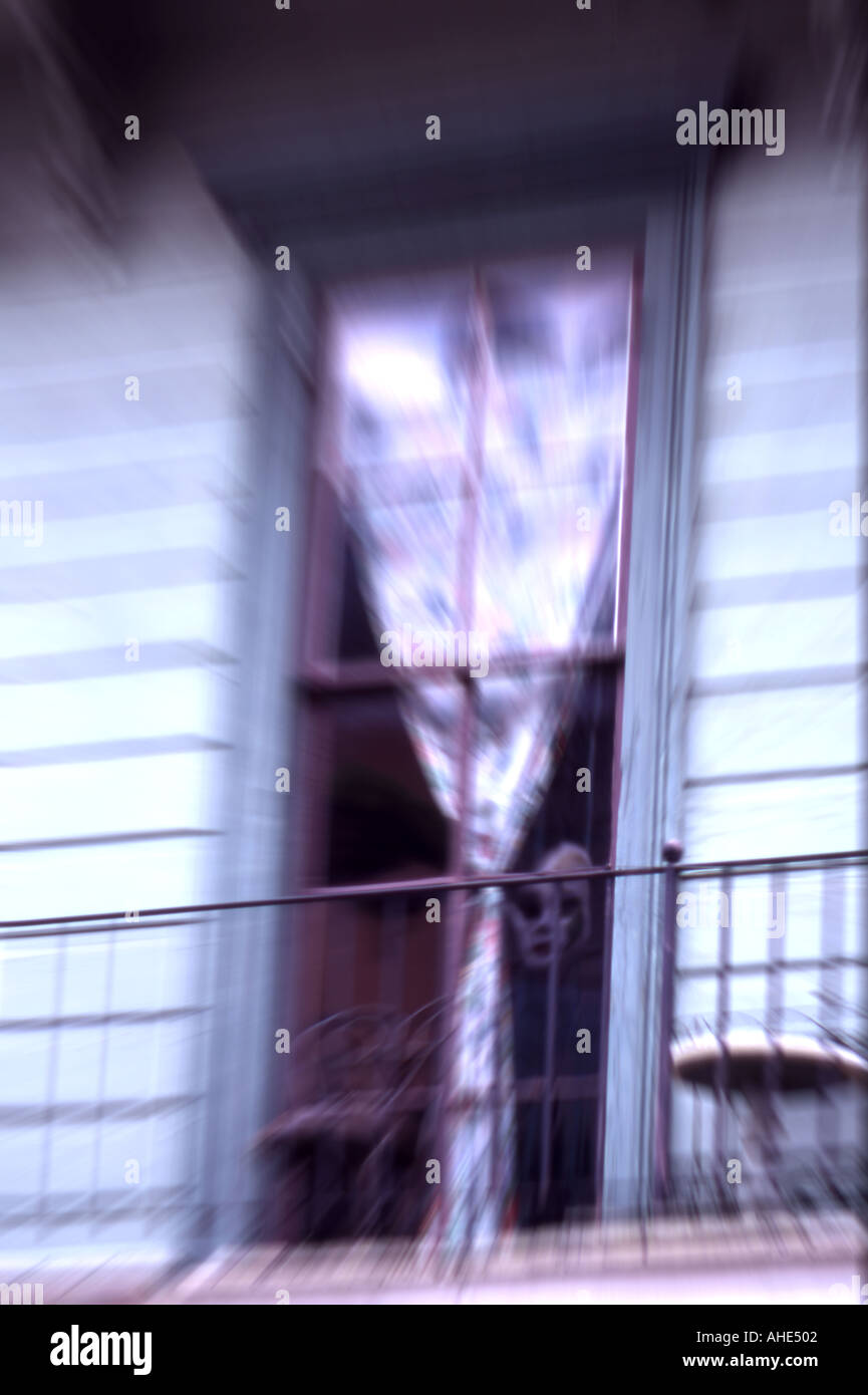 ghostly face in window behind curtain New Orleans USA Stock Photo - Alamy