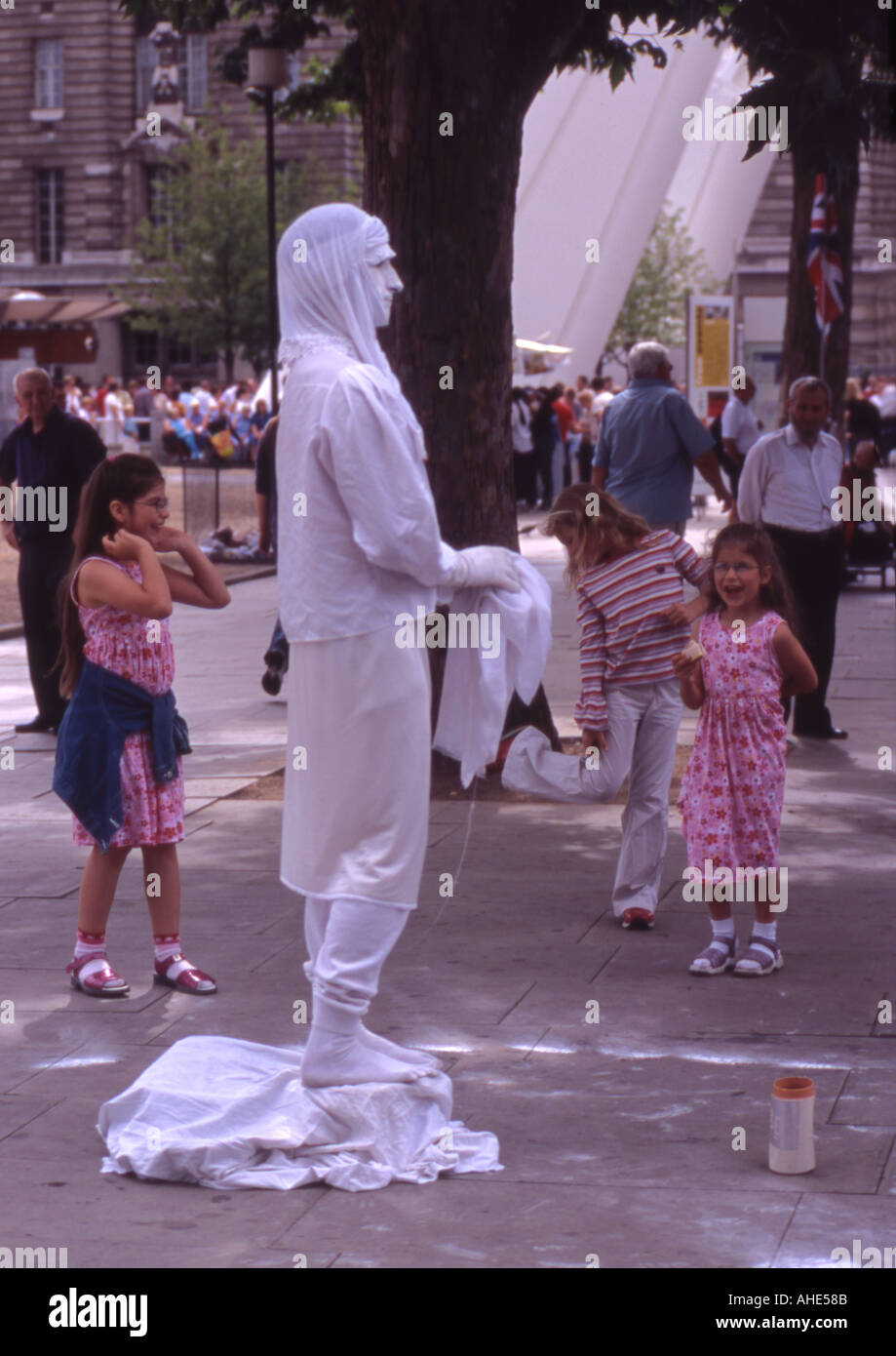 Posing static figure beside river Thames Stock Photo - Alamy