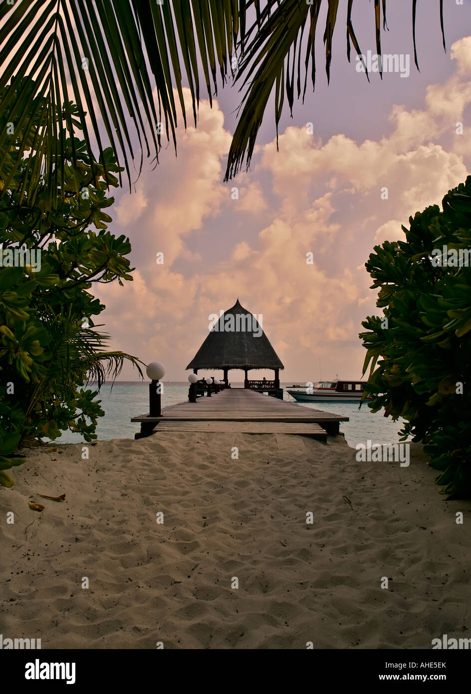 Mooring point with thatched roof and wooden bridge seen from the ...