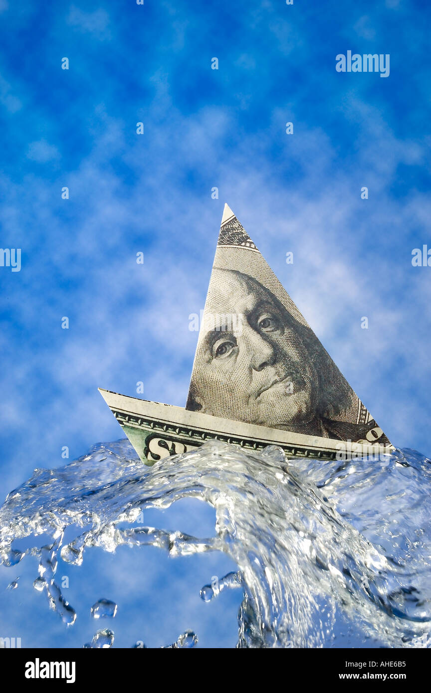Origami boat on water spout Stock Photo - Alamy