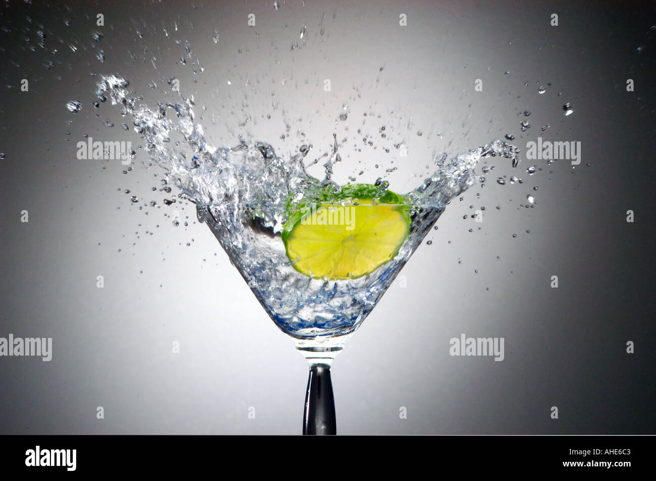 lime splashing in glass Stock Photo - Alamy