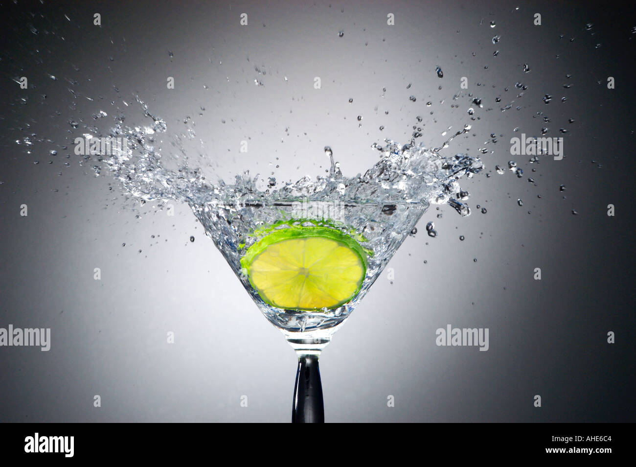 lime splashing into glass Stock Photo - Alamy