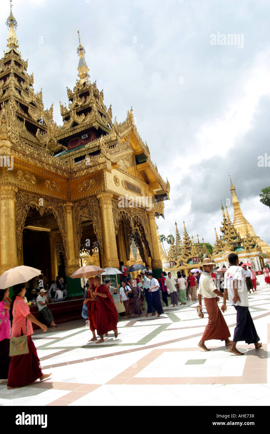 Myanmar crowd day sarongs portrait colour image color vertical image hi ...