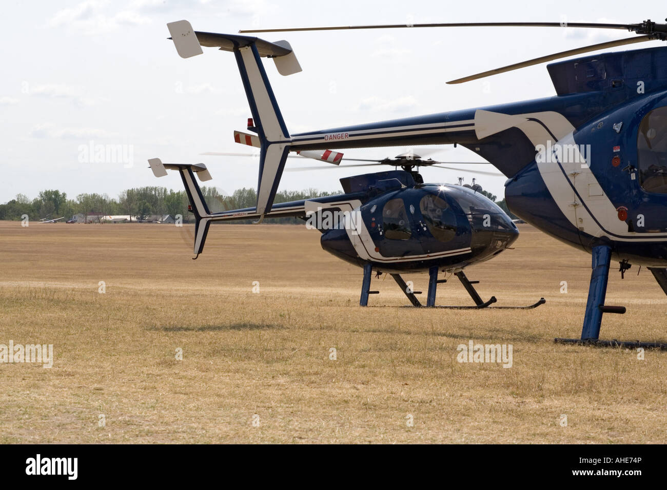 two blue helicopter on the ground Stock Photo - Alamy