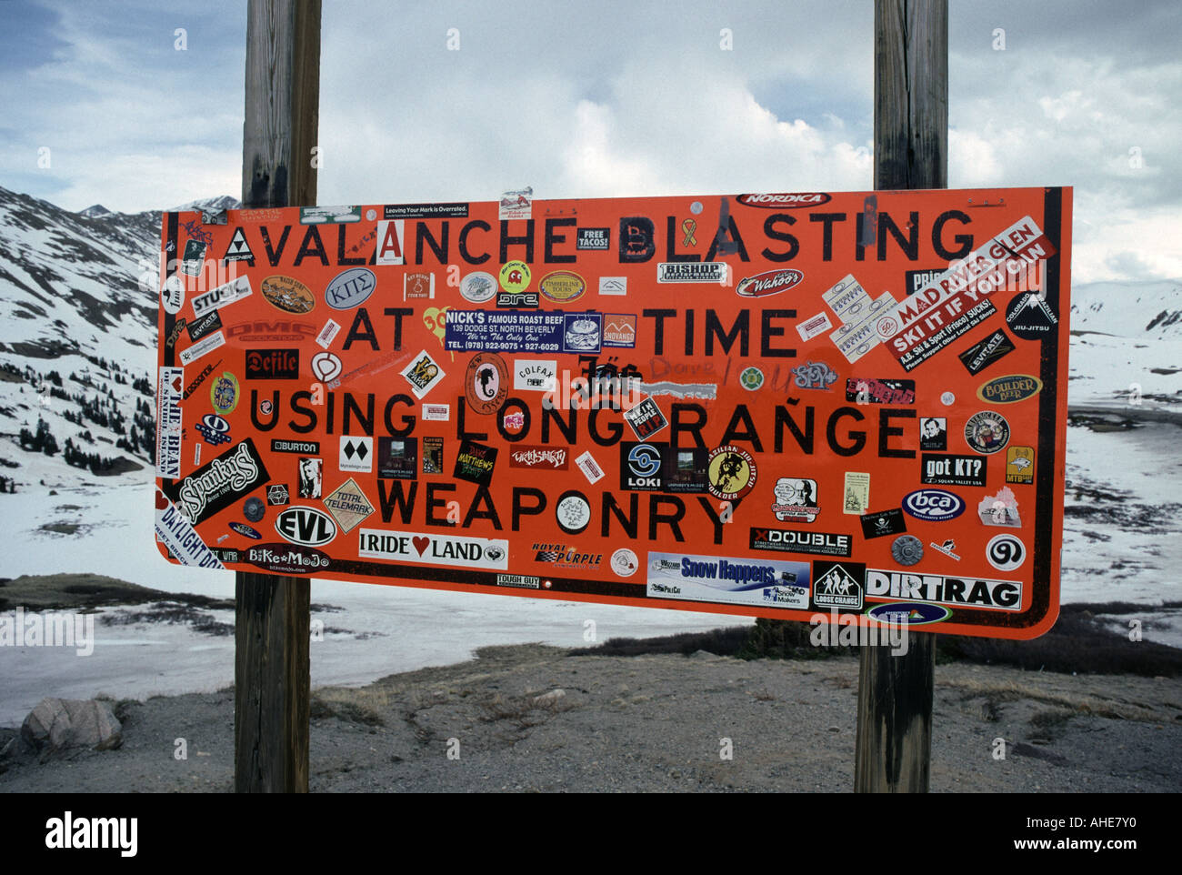 Avalanche blasting warning signpost with graffitti stickers Loveland ...