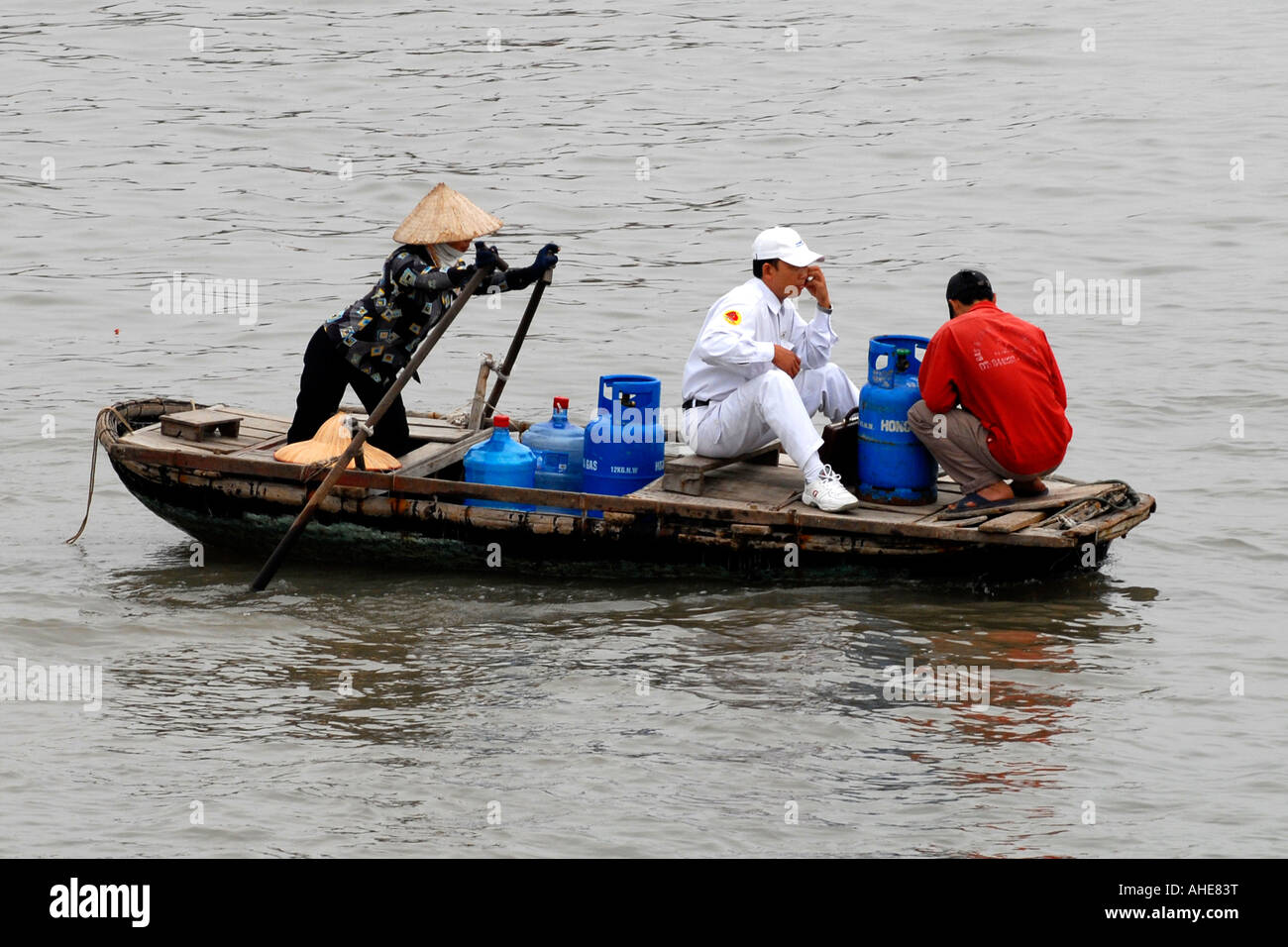 Asia Far East Vietnam , Halong Bay , boat lady in conical hat , non bai ...