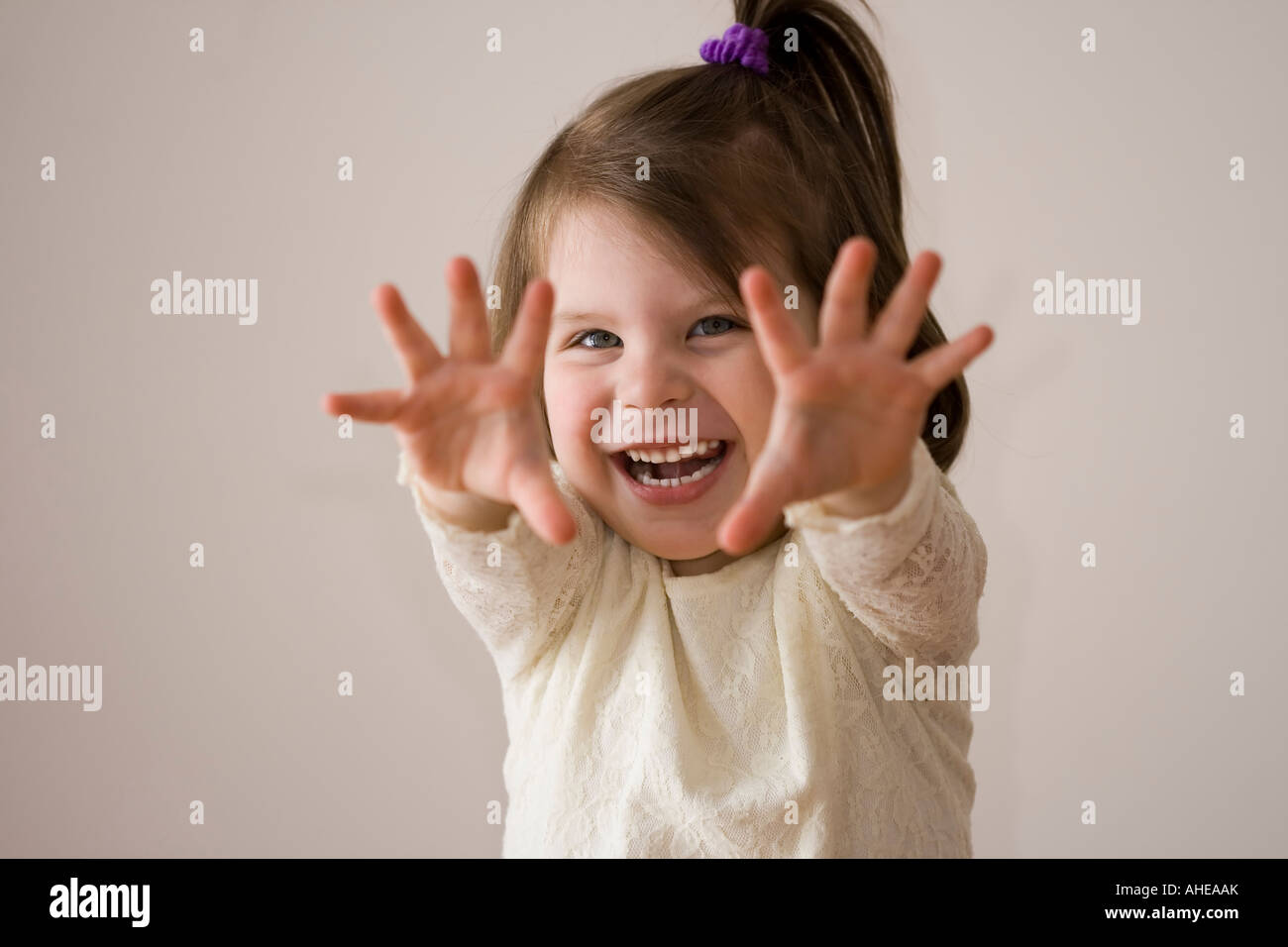 young girl hands towards camera Stock Photo - Alamy