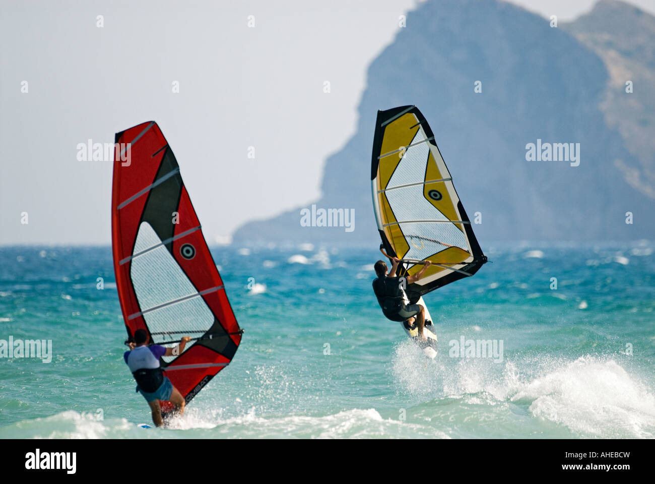 two windsurfers enjoy wind and waves in the mediterranean sea Stock ...