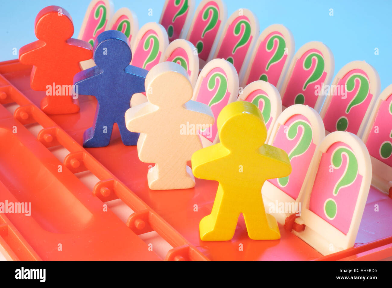 Wooden Children Figures on Quiz Game Stock Photo - Alamy