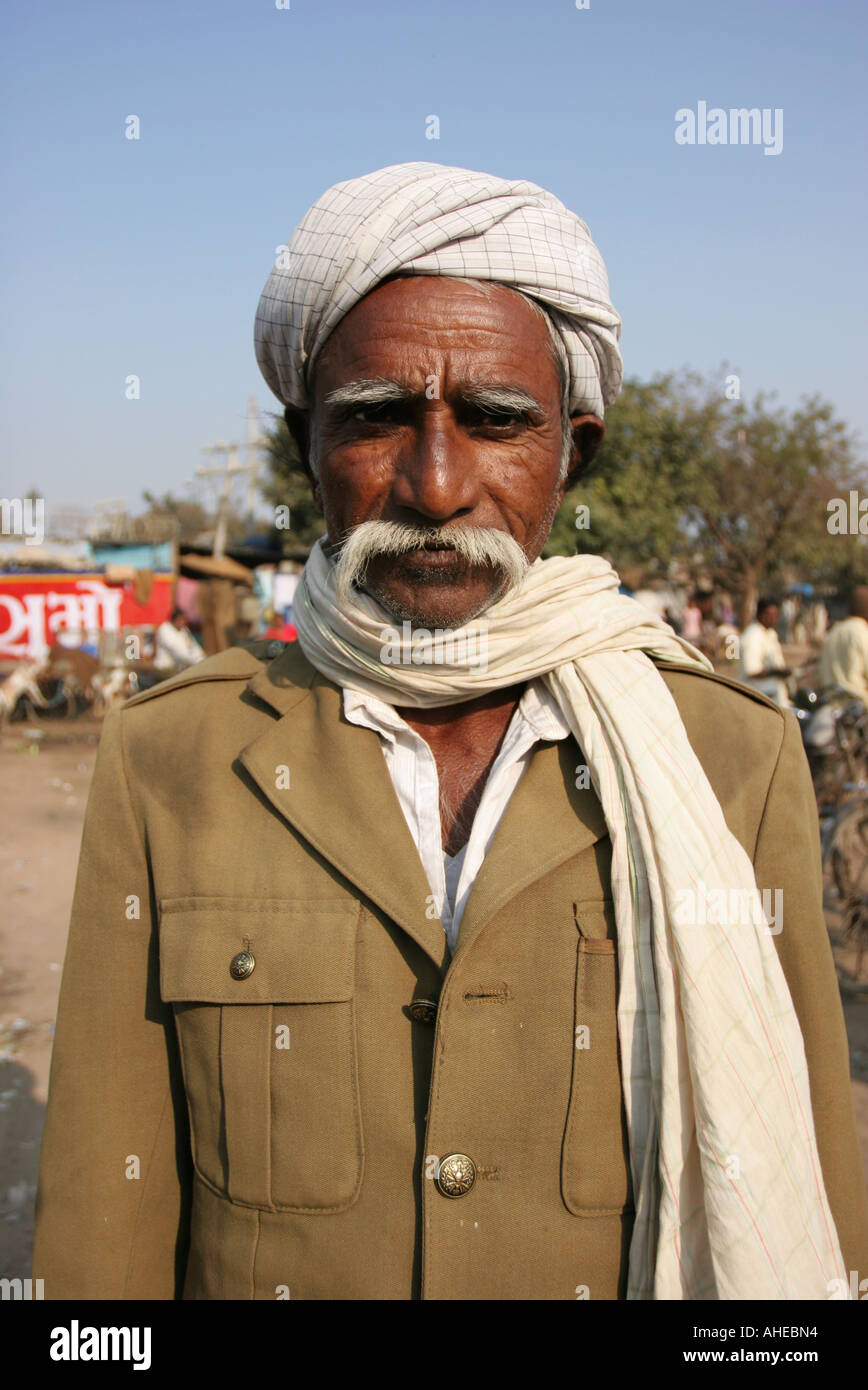 Indian man in soldiers jacket Stock Photo - Alamy