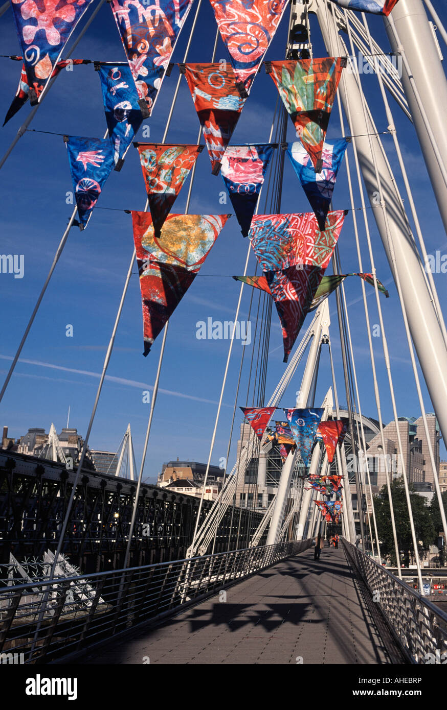Colourful pennants hanging beneath support arms over deck of Hungerford ...